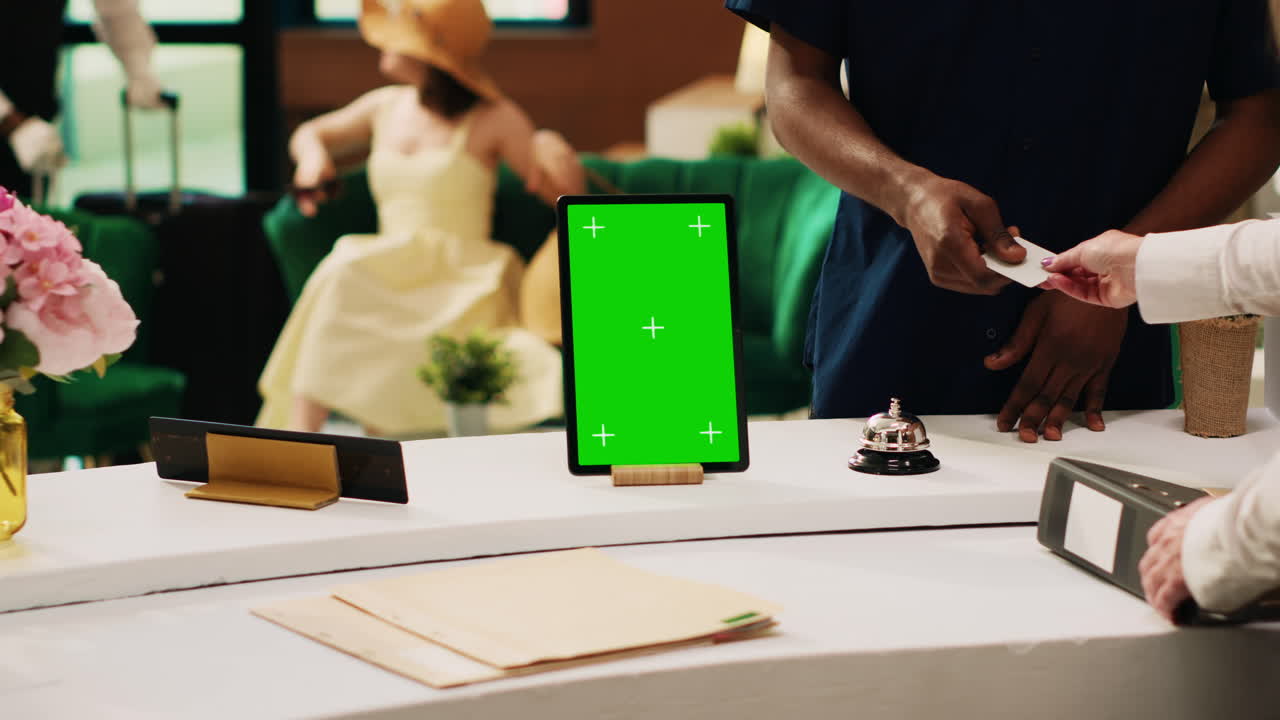 Premium stock video - Hotel concierge service with greenscreen