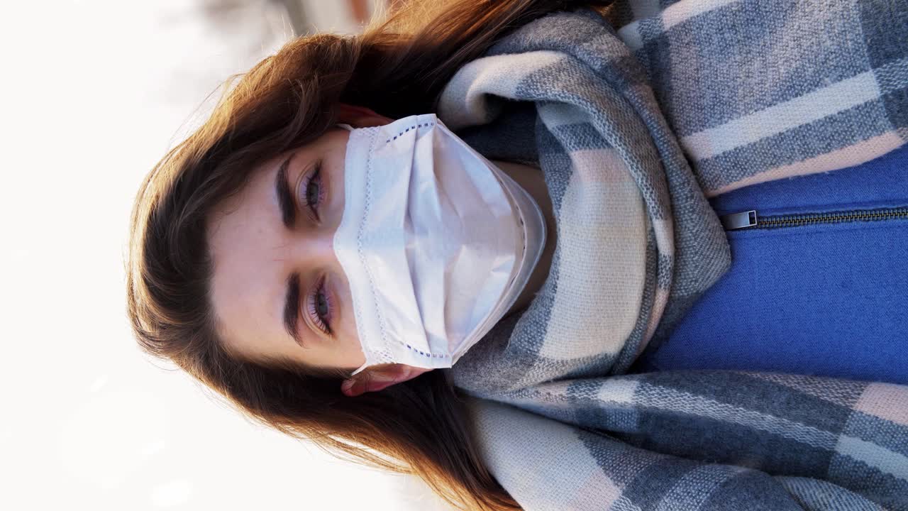 Premium stock video - Woman wearing a face mask outdoors