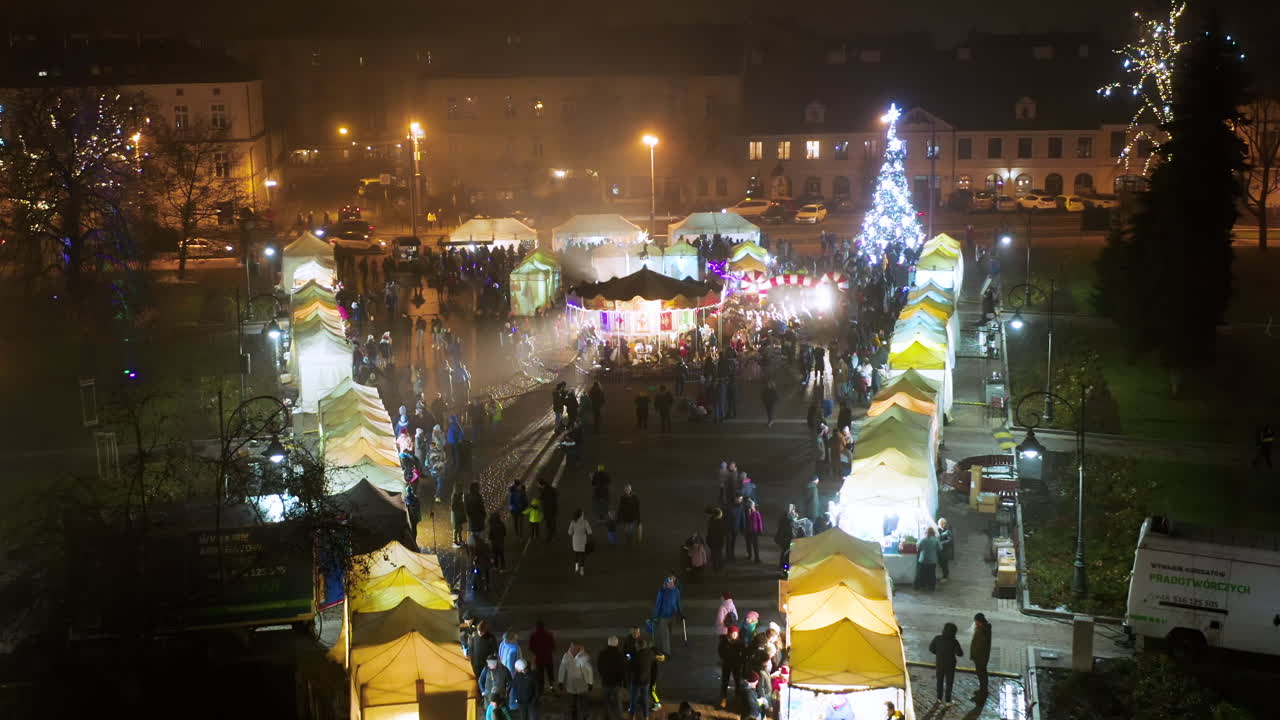 Drone view of Christmas stalls and carousel on the Podgorski Square ...