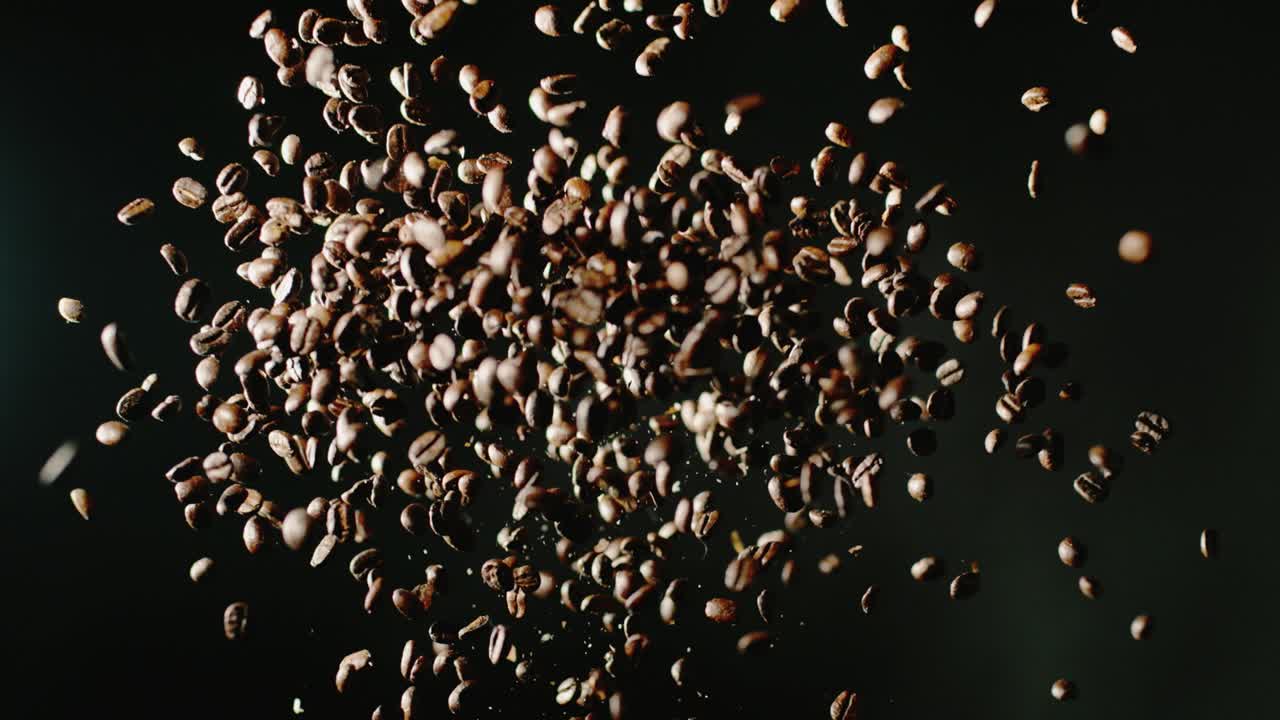 The coffee beans are thrown into the air Premium Stock Video Footage