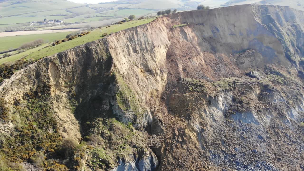 Premium stock video - Aerial view of massive rockfall debris at seatown ...