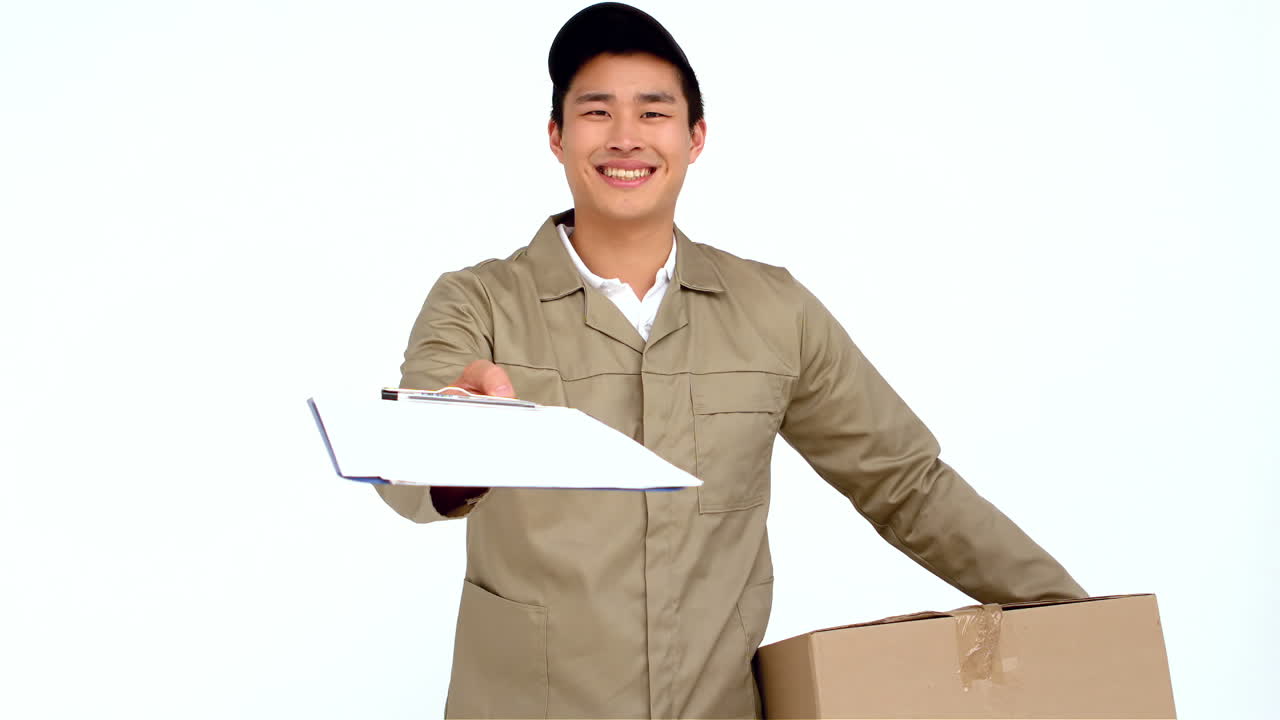 Smiling asian postman handing document to sign Premium Stock Video Footage