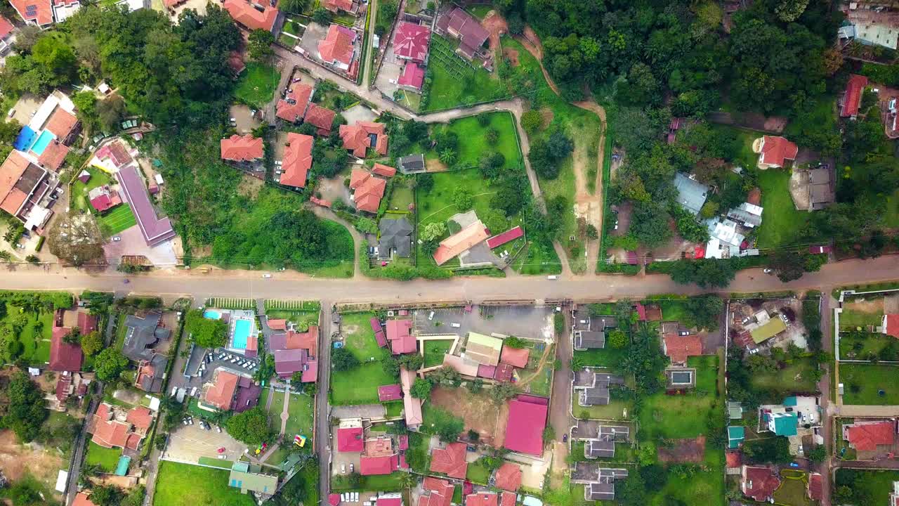 Overhead view of tank hill road between residential houses in kampala ...