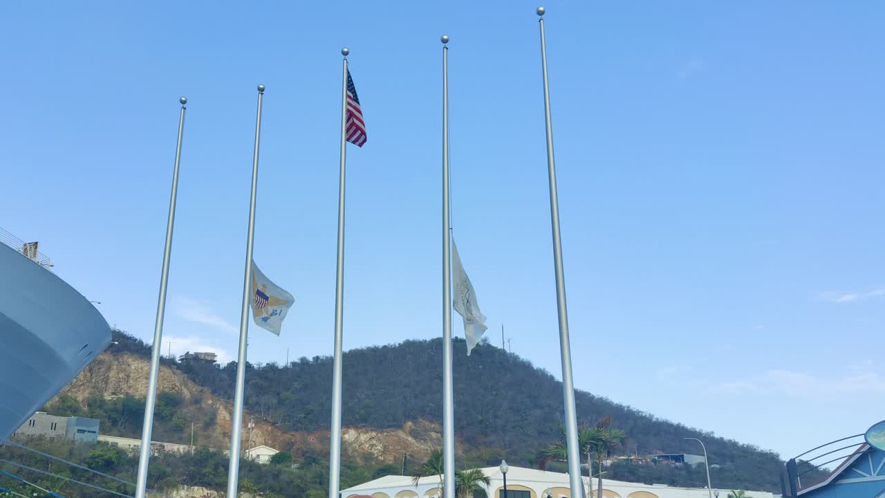 Flag of st thomas virgin island and usa waving on poll on port of st ...