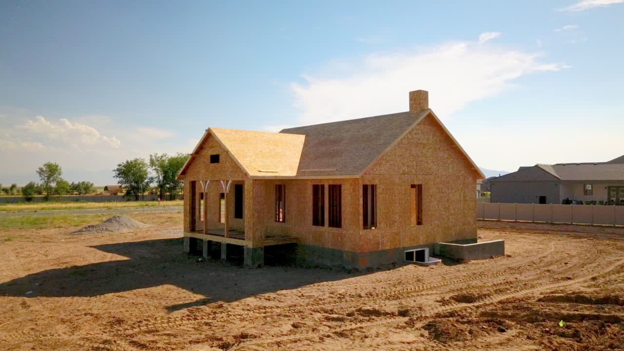 Premium stock video - A drone shot pushing in on a recently framed and ...