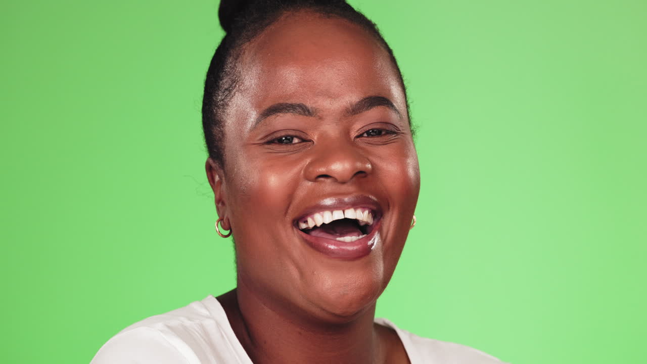 Premium stock video - Green screen, laughing and face of a black woman