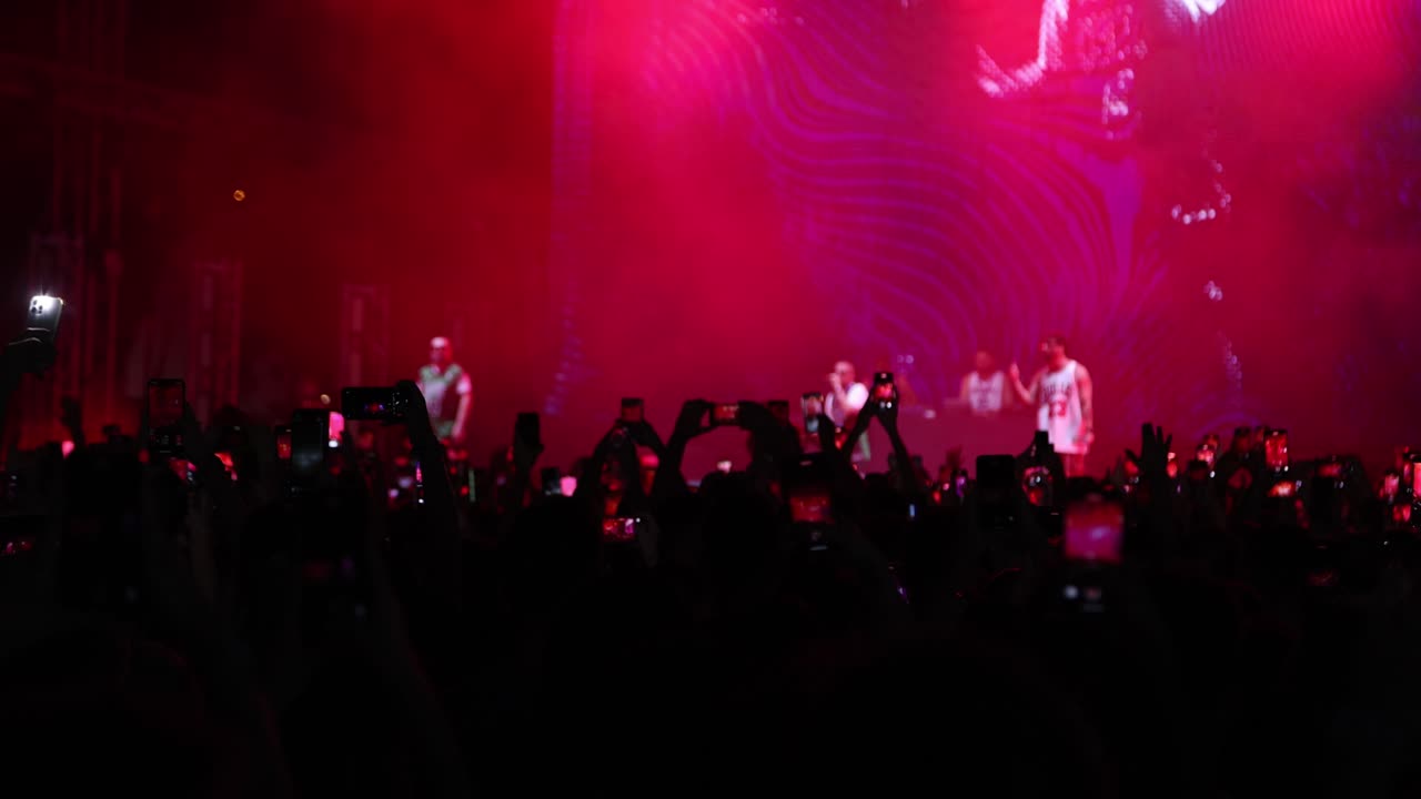 Premium stock video - Fans filming on their smartphones live concert ...