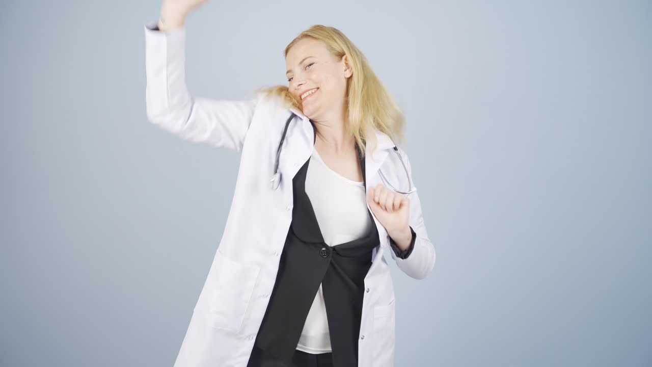 Dancing doctor. happy and cute. Premium Stock Video Footage