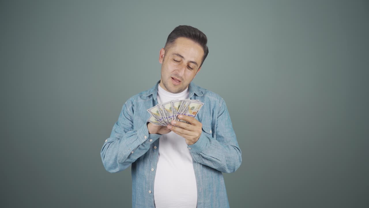 Premium stock video - The man loves money.