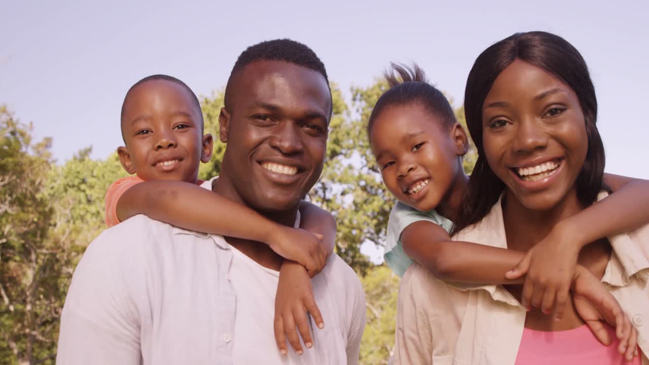 Premium stock video - Couple carrying their children on their back