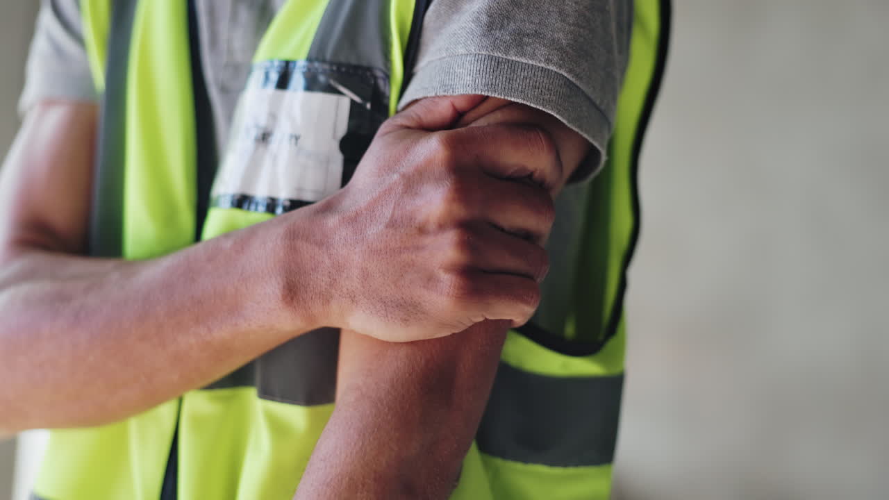 Construction Worker with Arm Injury | Premium Stock Video Footage
