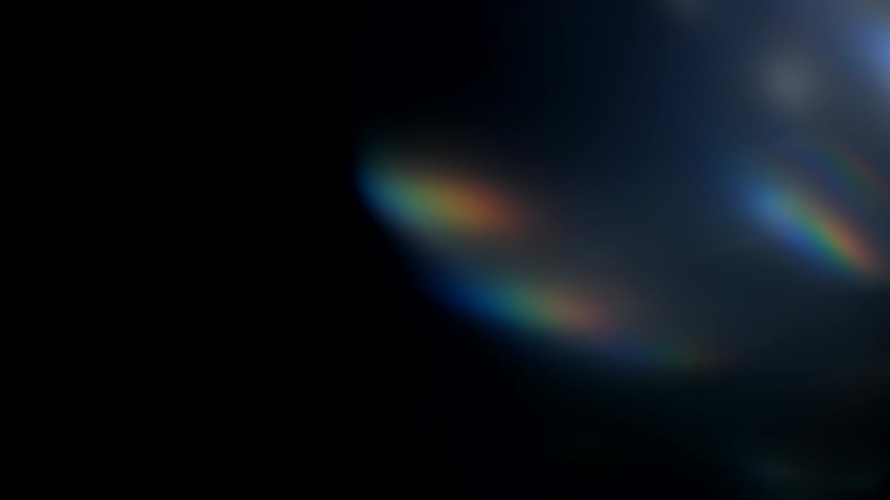 Abstract light leaks on black background. | Premium Stock Video Footage