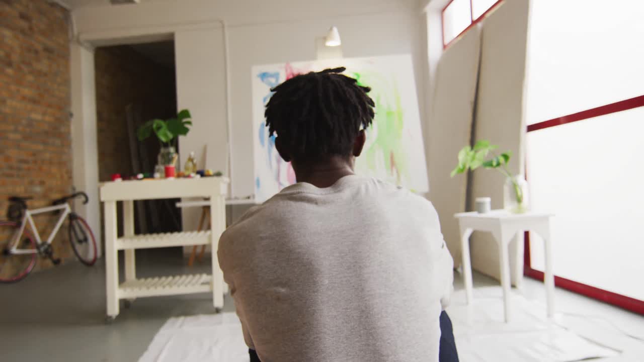 Premium stock video - Rear view of thoughtful african american male ...