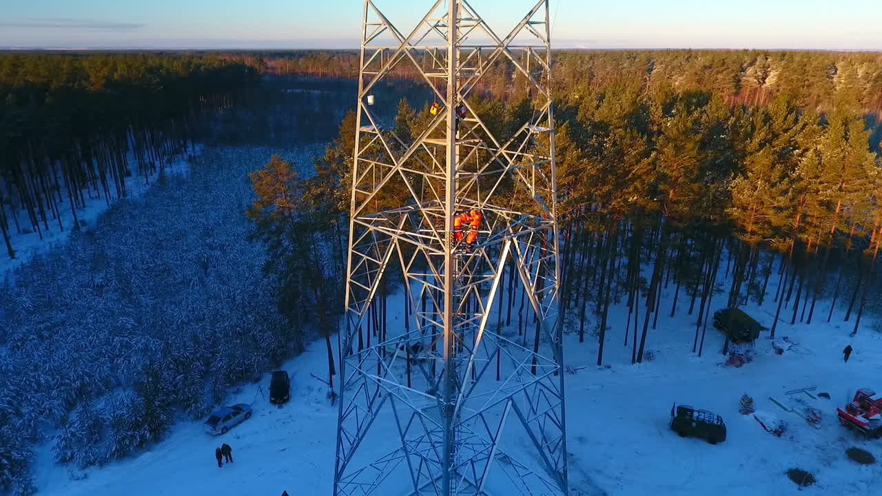 Premium stock video - Electricity workers on electric pylon ...