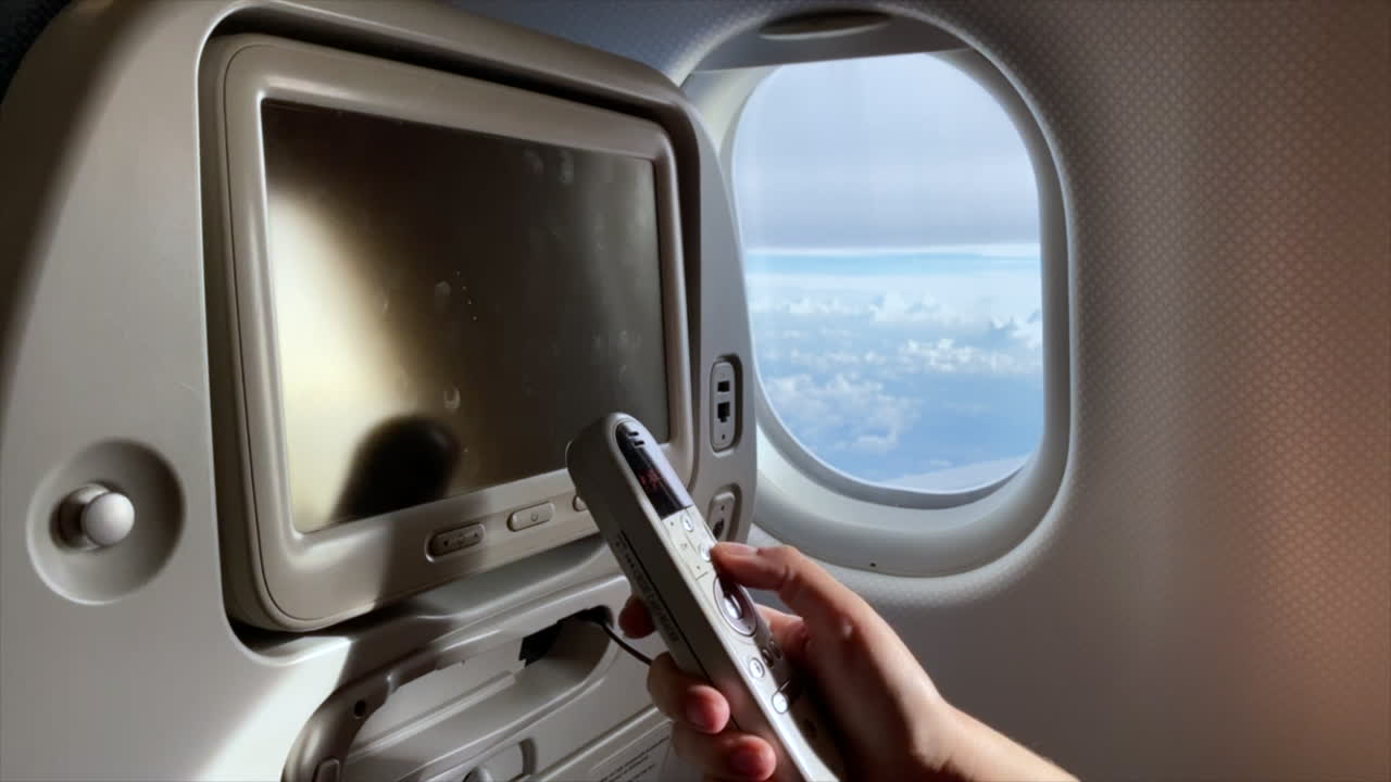 Airplane In-Flight Entertainment System with Remote | Premium Stock ...