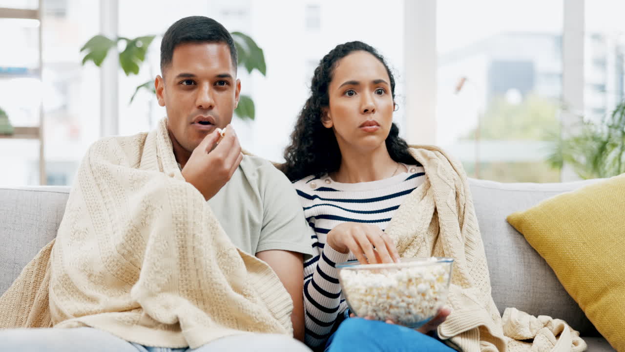 Scary movie, jump scare and couple at home Premium Stock Video Footage