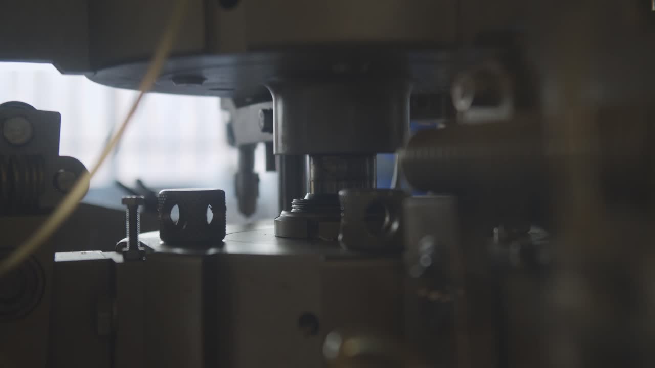 A Heavy Industrial Machine At Work - Cosmetic Manufacturing Laboratory - Extreme Close Up, Slow ...