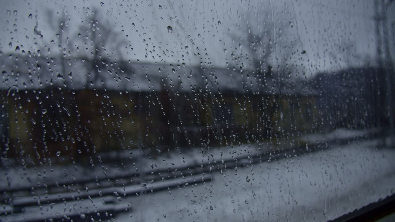 Looking Out A Window, It's Raining And Small Waterdrops Stick To The ...