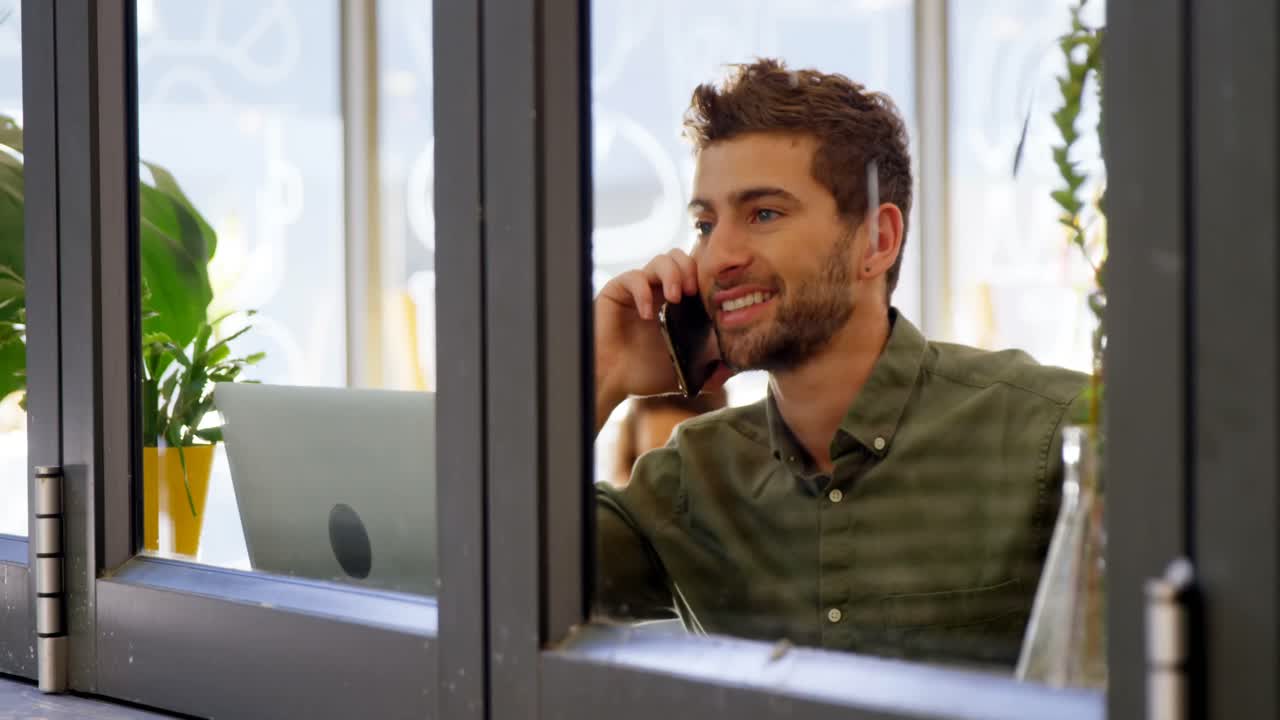 Premium stock video - Man talking on mobile phone 4k