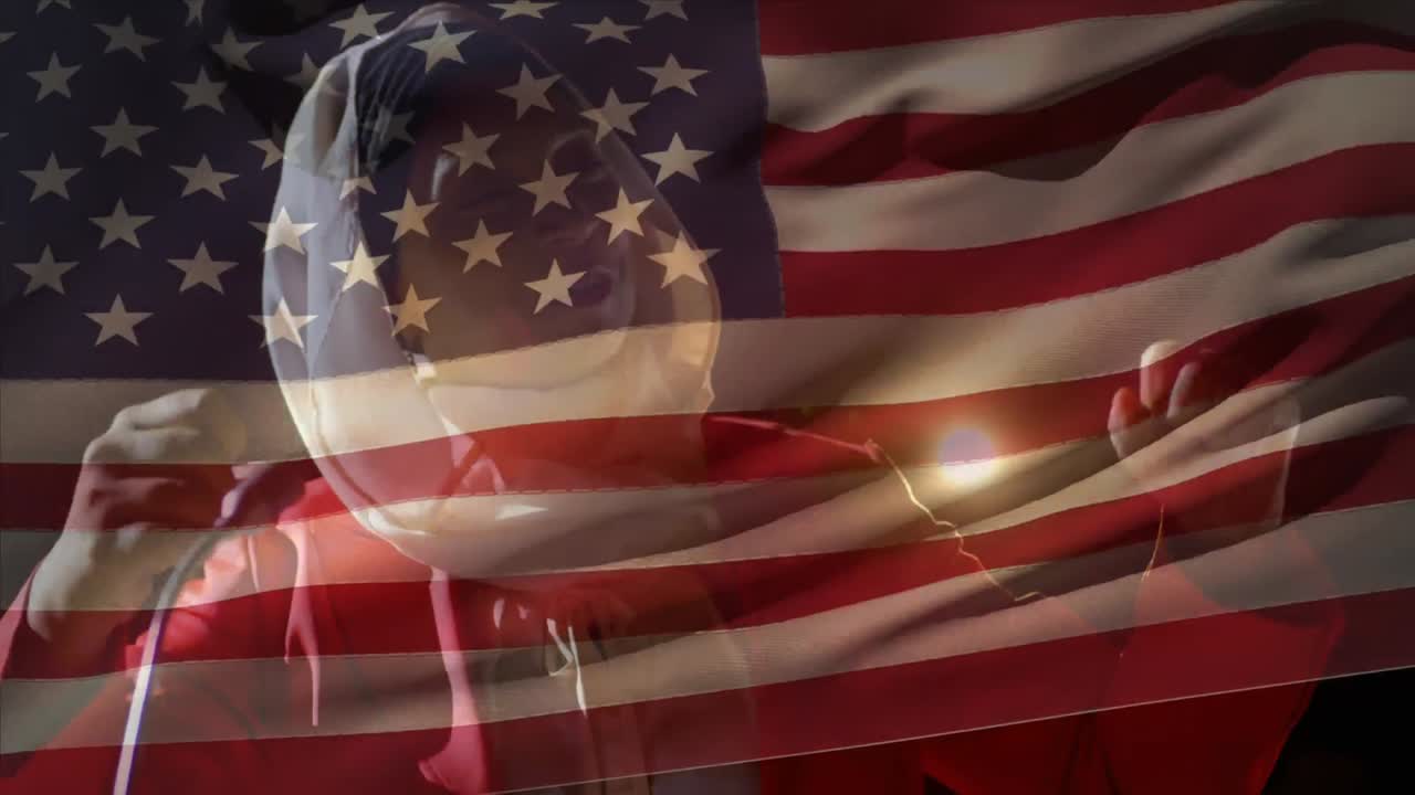 Premium stock video - Animation of american flag waving over mixed race ...