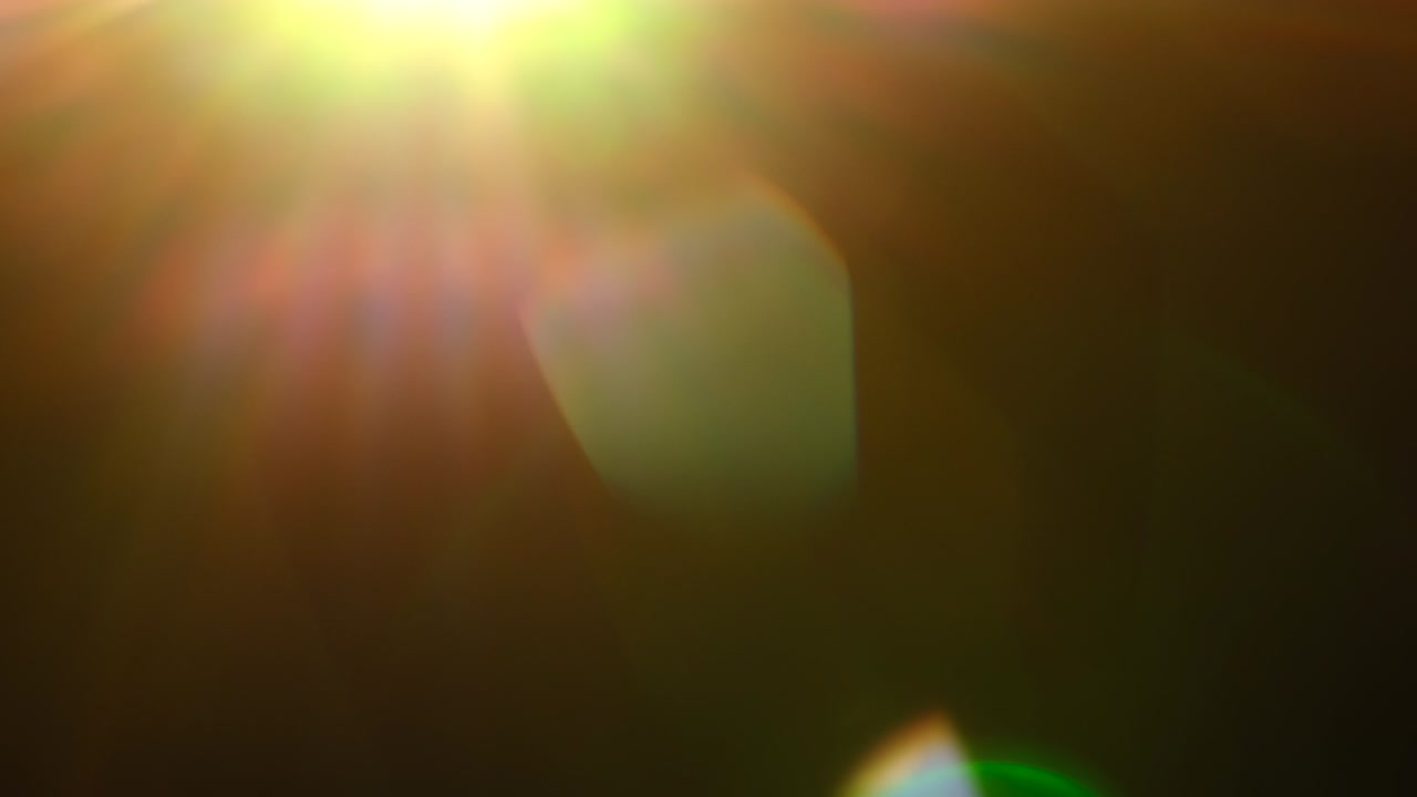 Abstract light leaks on black background. | Premium Stock Video Footage