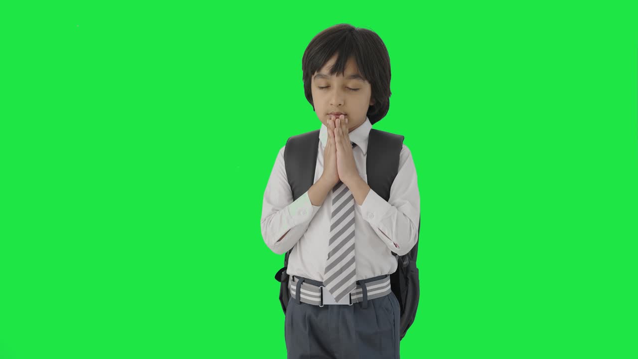 Indian school boy praying to God Green screen | Premium Stock Video Footage