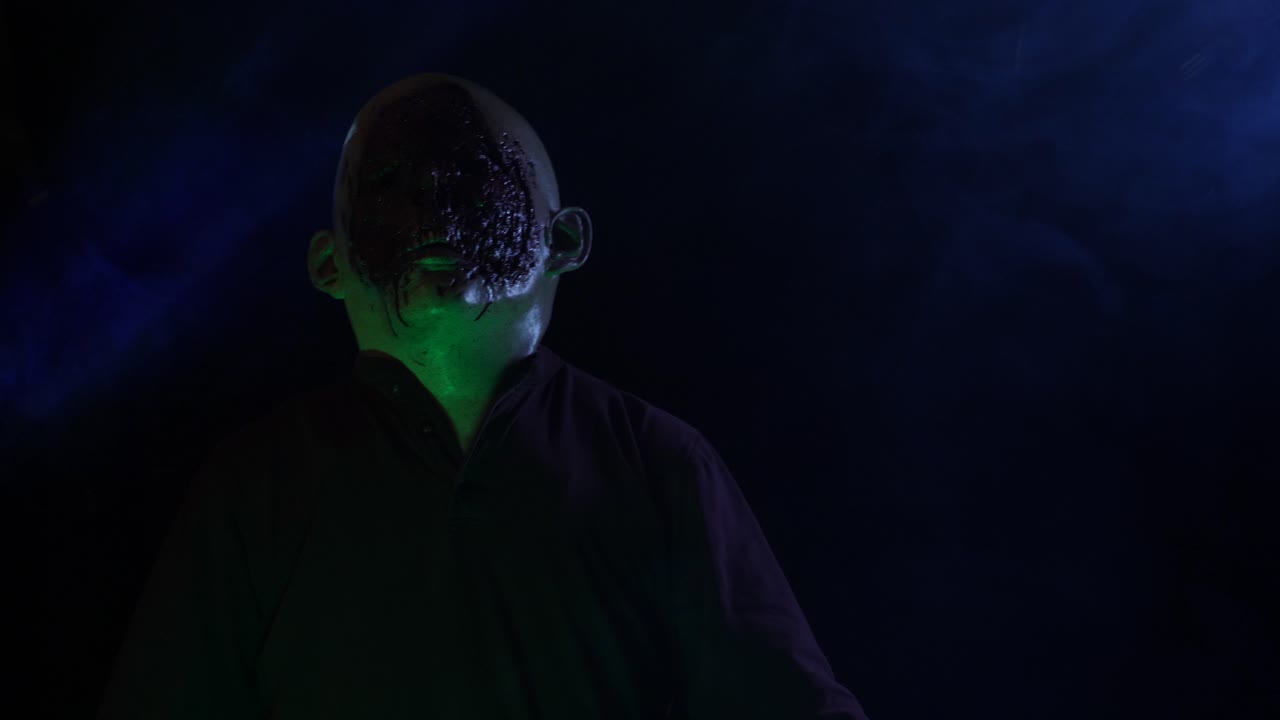 Faceless Zombie stands up in smokey roo | Premium Stock Video Footage