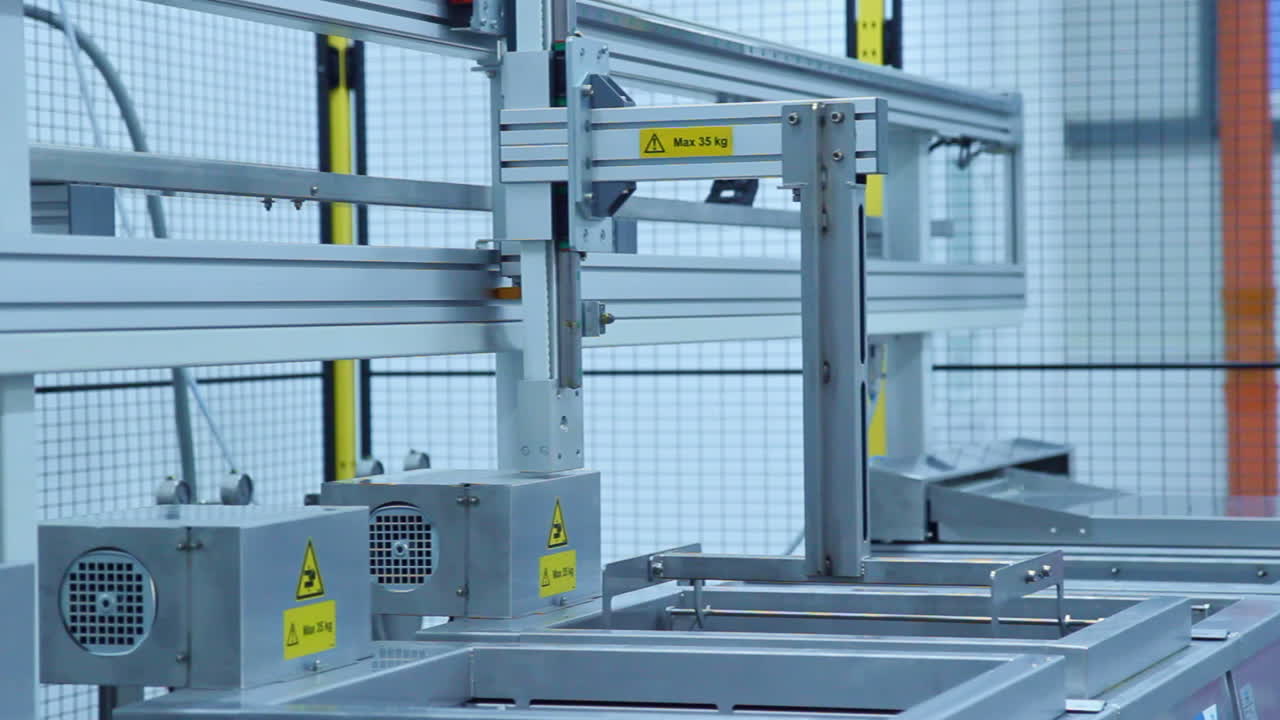 Premium stock video - Metal container with blanks is dipped in tank ...