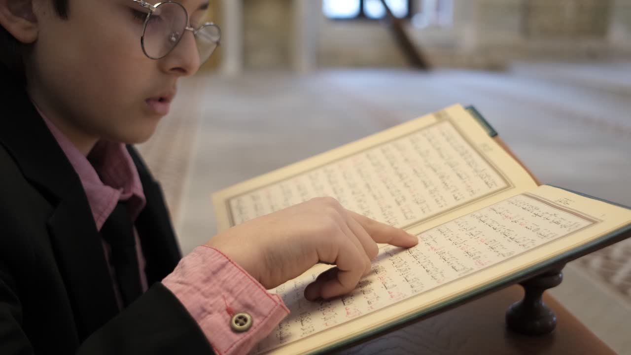 Boy reading al-quran Premium Stock Video Footage