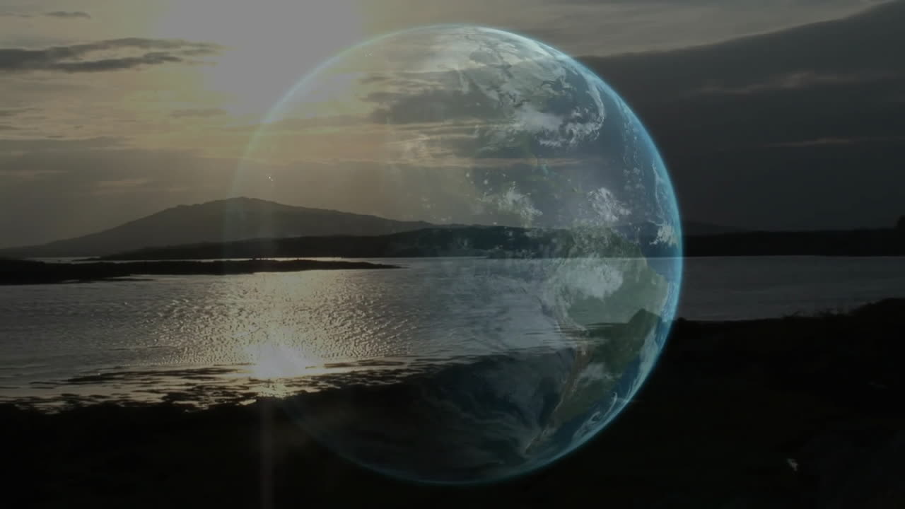 Digital Earth globe floating over calm water at sunset, reflecting warm ...
