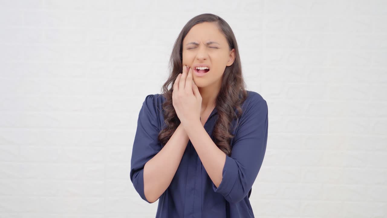 Premium stock video - Indian girl having toothache and pain