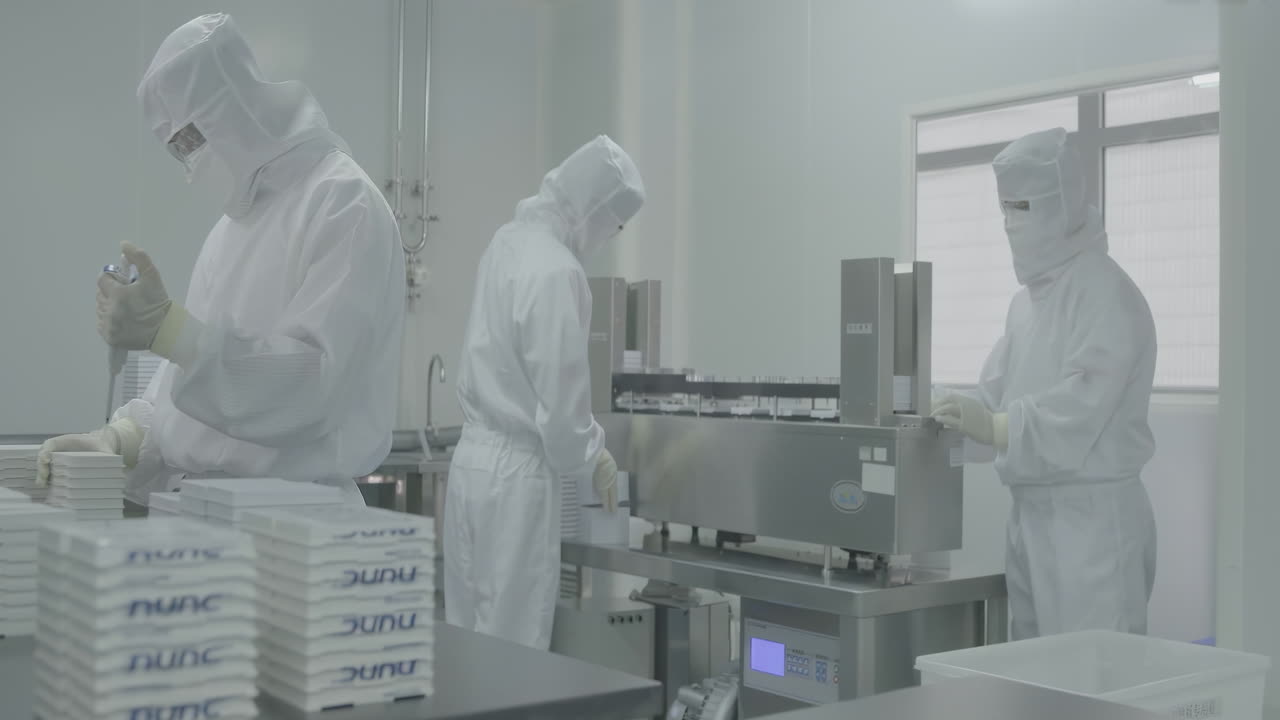 Medical worker in protective suits, gear developing new drugs or new ...
