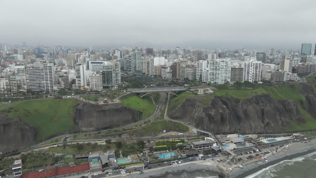 Onshore Aerial Of Clifftop And Beach Traffic In Dense Cloudy Lima Peru ...