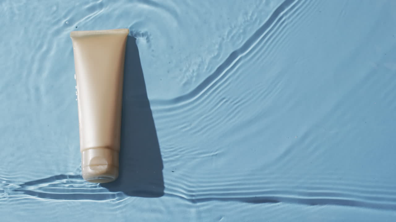 Premium stock video - Video of beauty product tube in water with copy ...