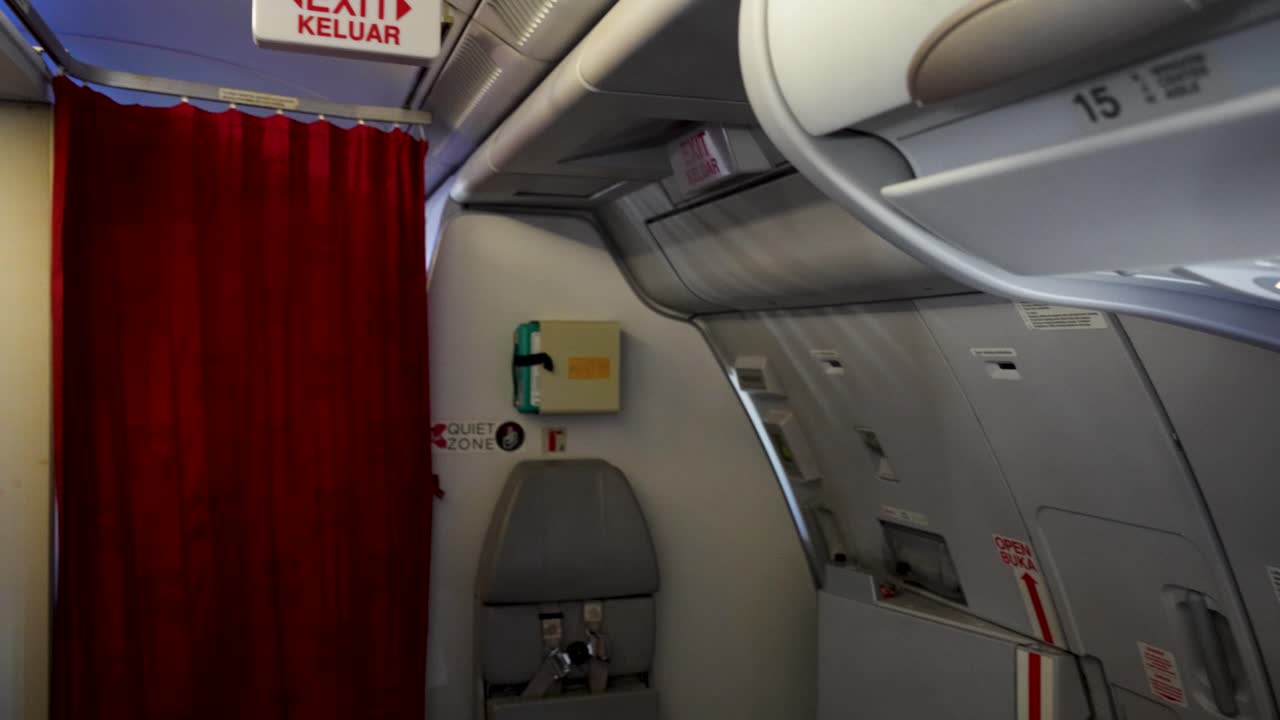 Premium stock video - Pan inside the plane showing emergency exit sign ...