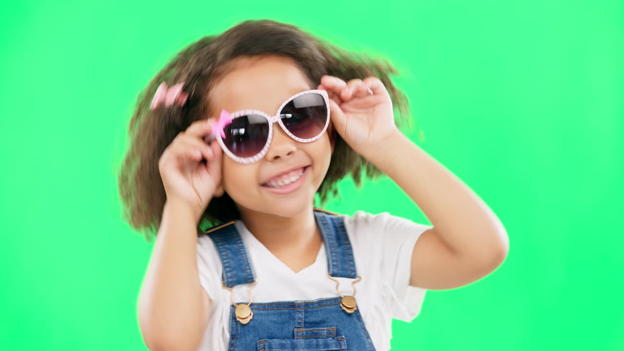 Premium stock video - Happy, green screen and child with sunglasses