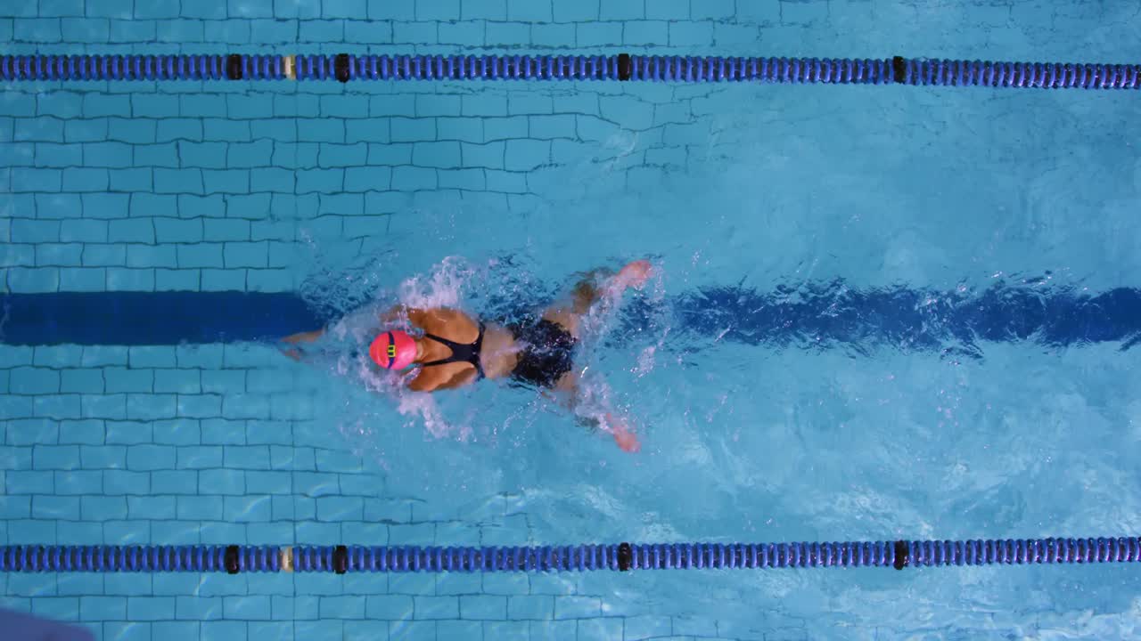 Premium stock video - Swimmer training in a swimming pool