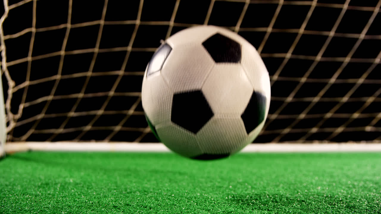 Close-up of football bouncing on artificial grass 4k Premium Stock ...