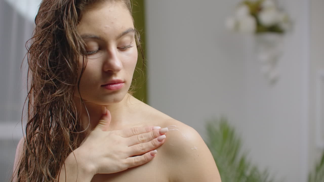 Premium stock video - Woman skin care. close up of female hand applying ...