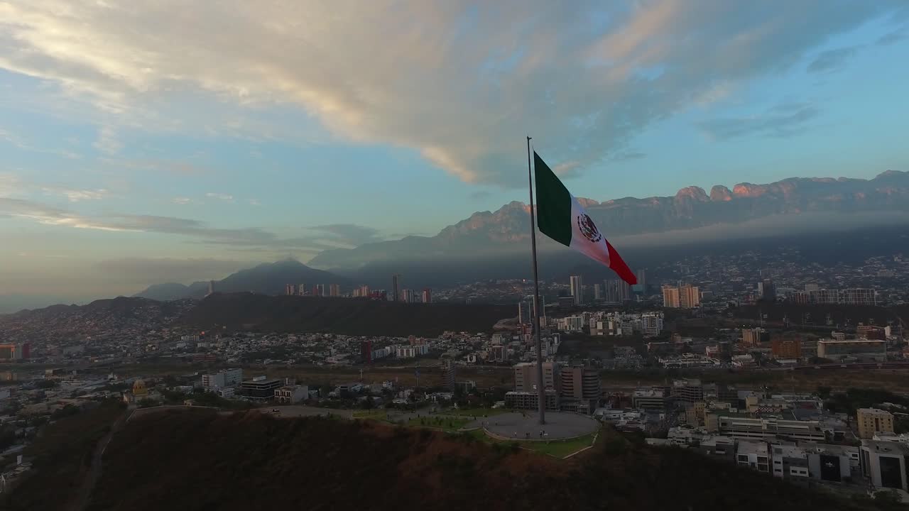 Aerial drone shot of the mexican flag in the obispado hill in monterrey ...