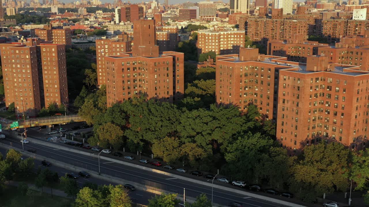 Premium stock video - Cinematic aerial rise over harlem housing project r