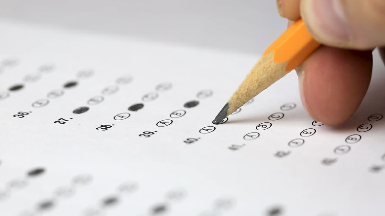 Premium stock video - Macro of multiple choice test. filling out bubbles