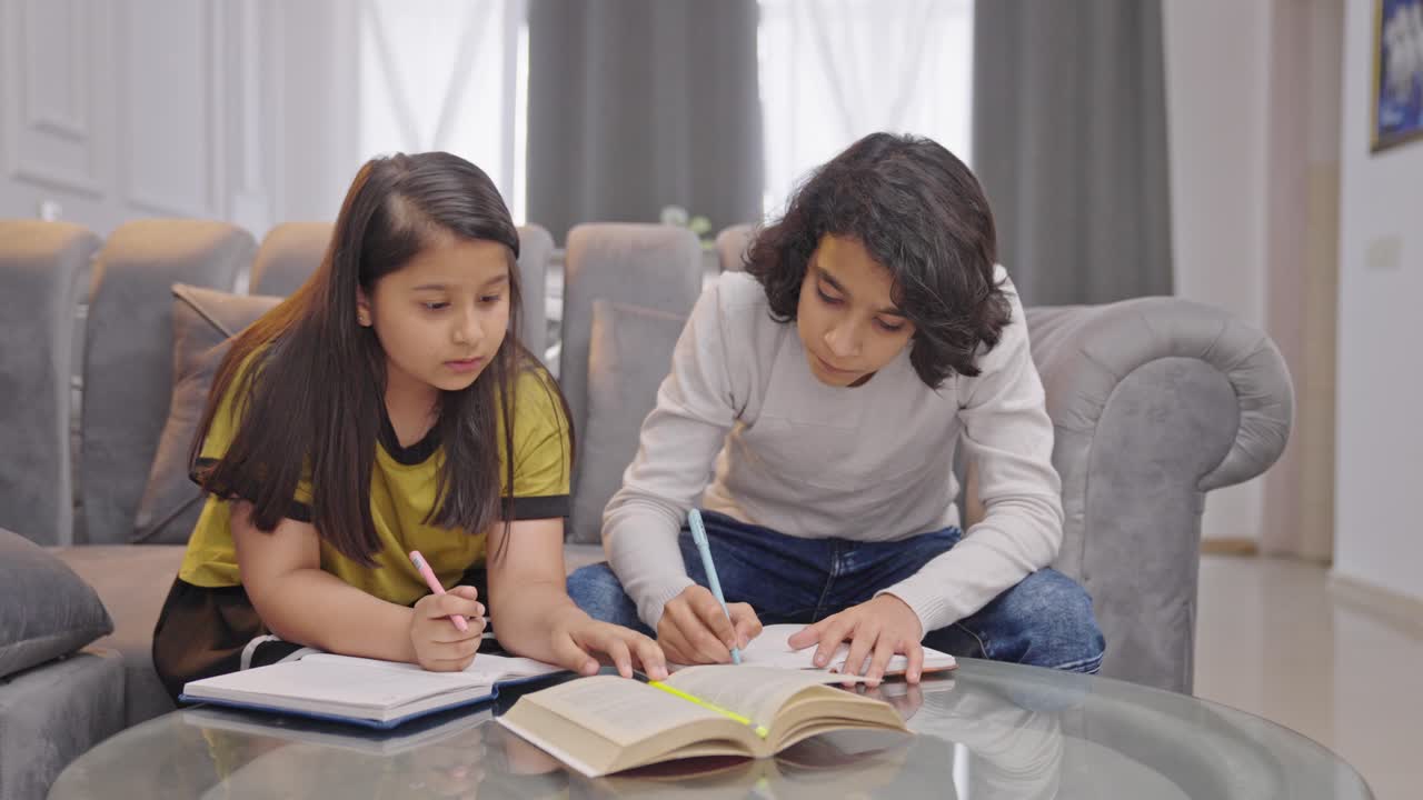 Indian siblings studying and learning together at home | Premium Stock ...