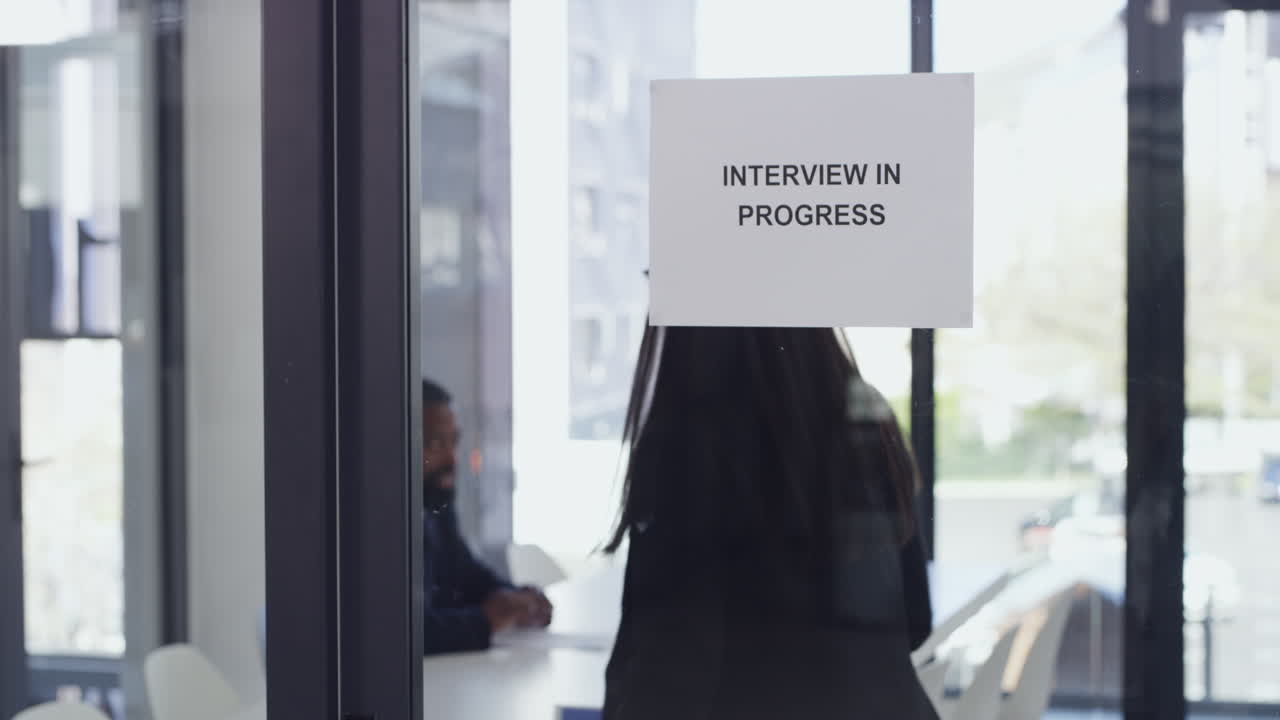 A Woman Entering The Boardroom For Her Interview Free Stock Video ...