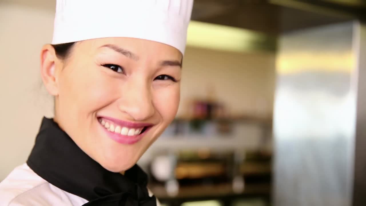 Premium stock video - Happy chef smiling at camera