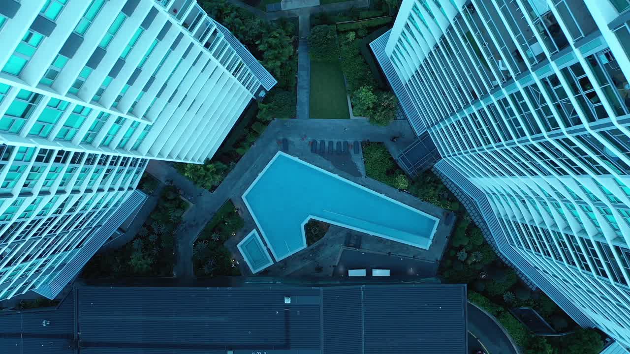 Premium stock video - Top down flying upwards shot of swimming pool in ...
