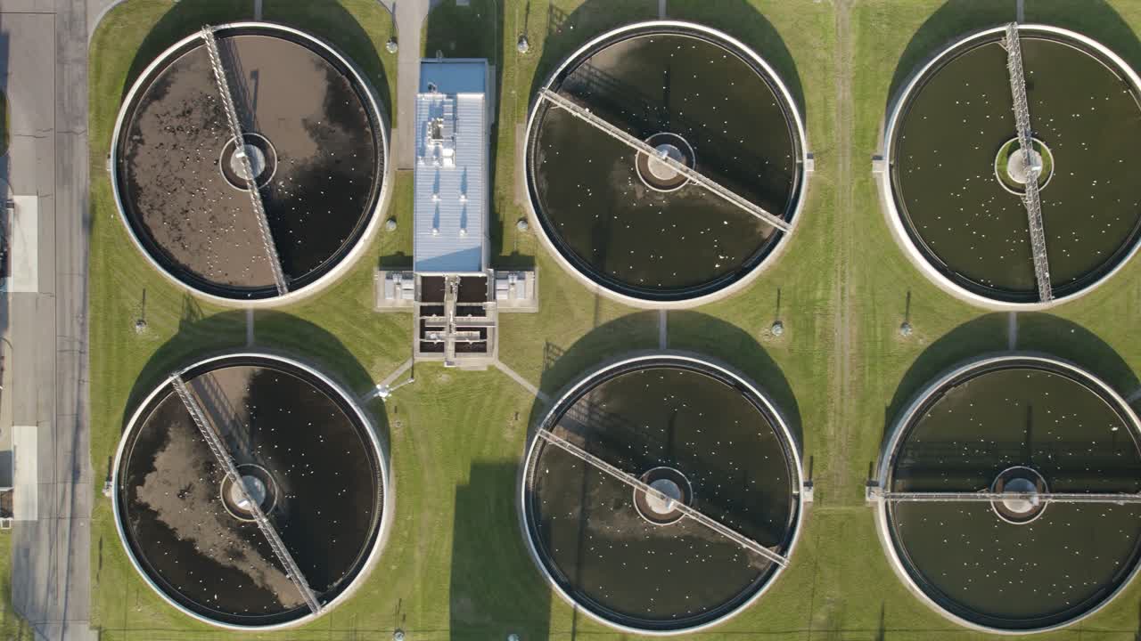Aerial top-down shot of the clarifier tanks in a huge biological ...