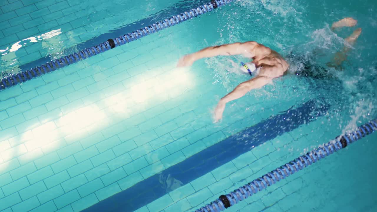 Premium stock video - Swimmer training in a swimming pool