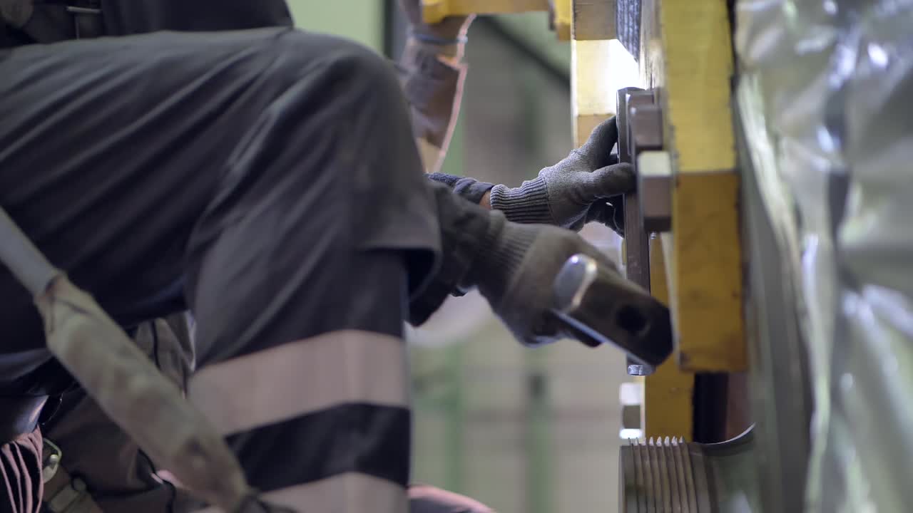 Worker hitting striking wrench with hammer, slow motion closeup Premium ...