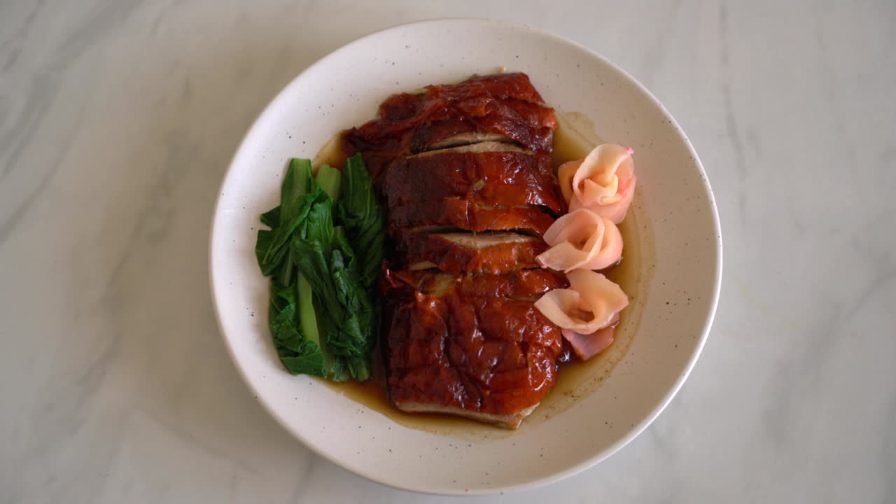 Premium stock video - Barbecue roasted duck on plate